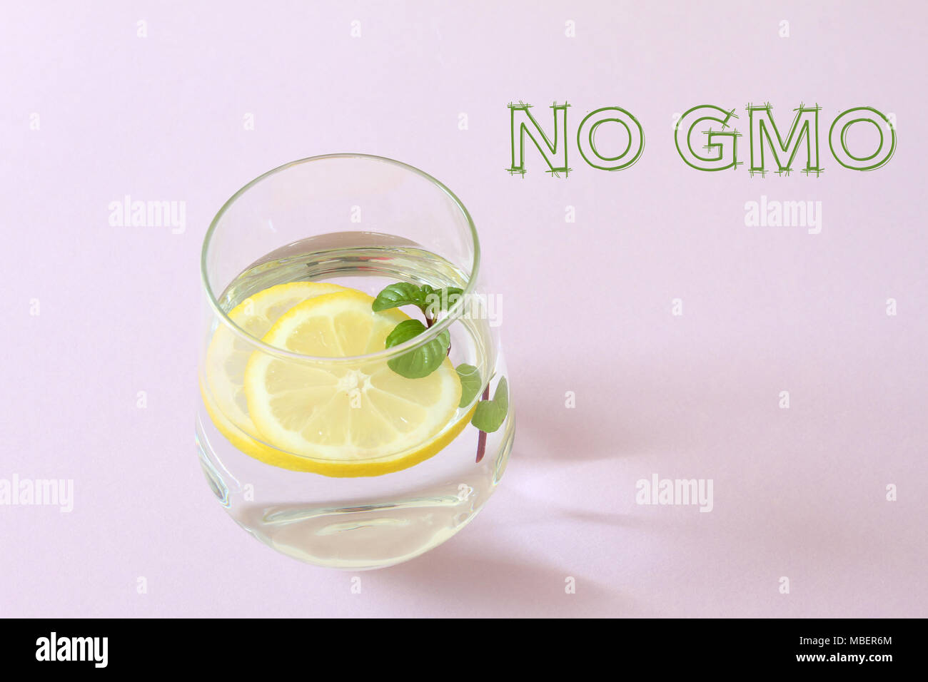 No GMO. Glass of water, lemon and mint. Detox and healthy food concept ...