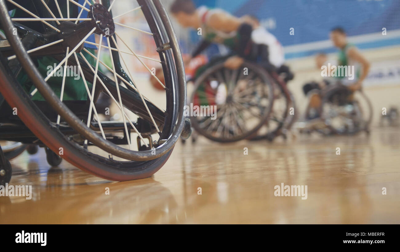 Handicapped basketball player in a wheelchair during sportive training ...