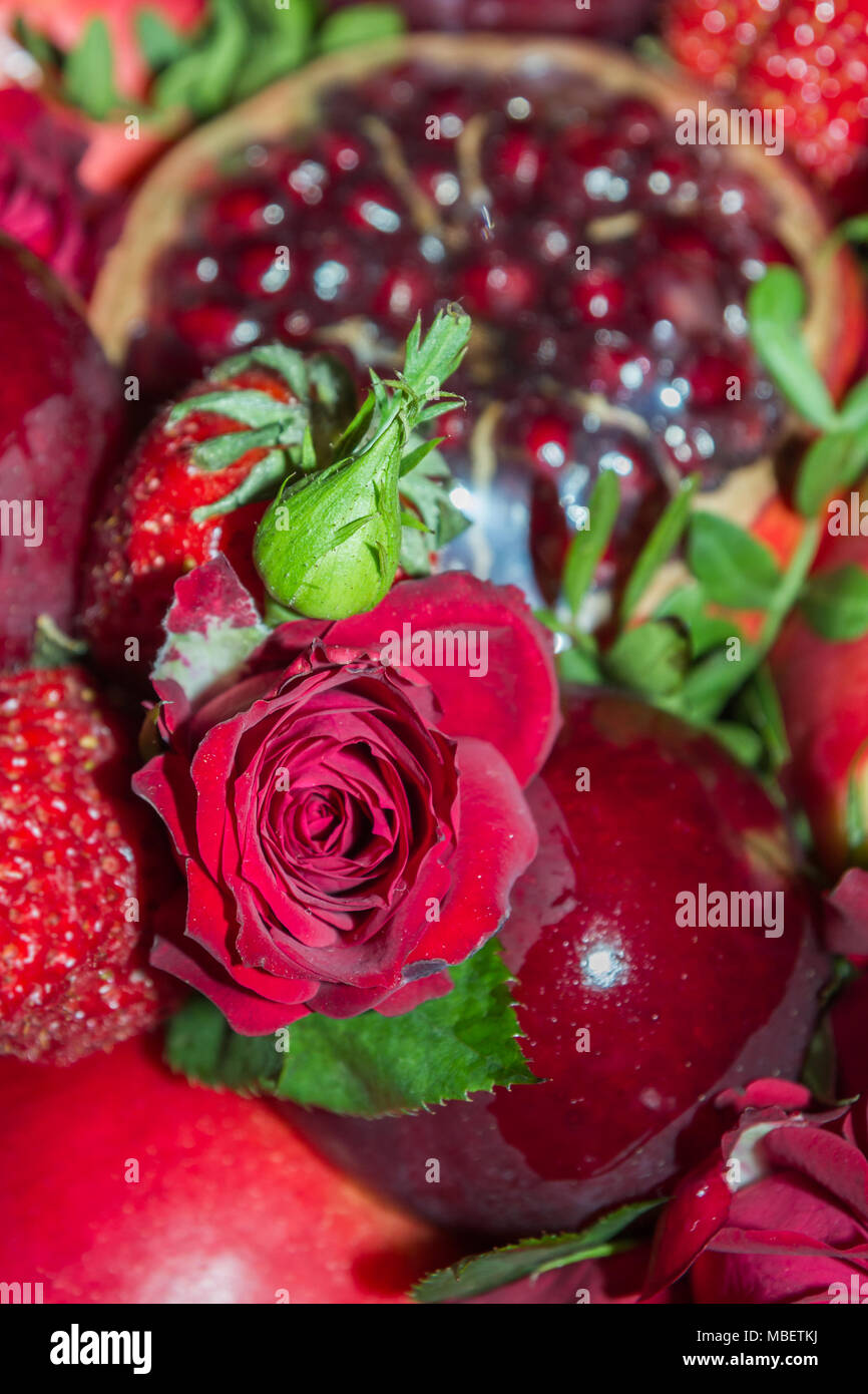 Bright red beautiful bouquet of fruits and flowers Stock Photo - Alamy
