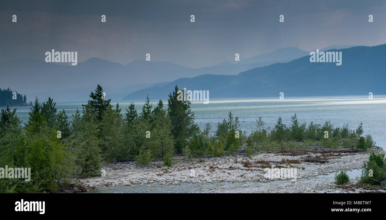 Lake with mountain range in the background, British Columbia, Canada ...