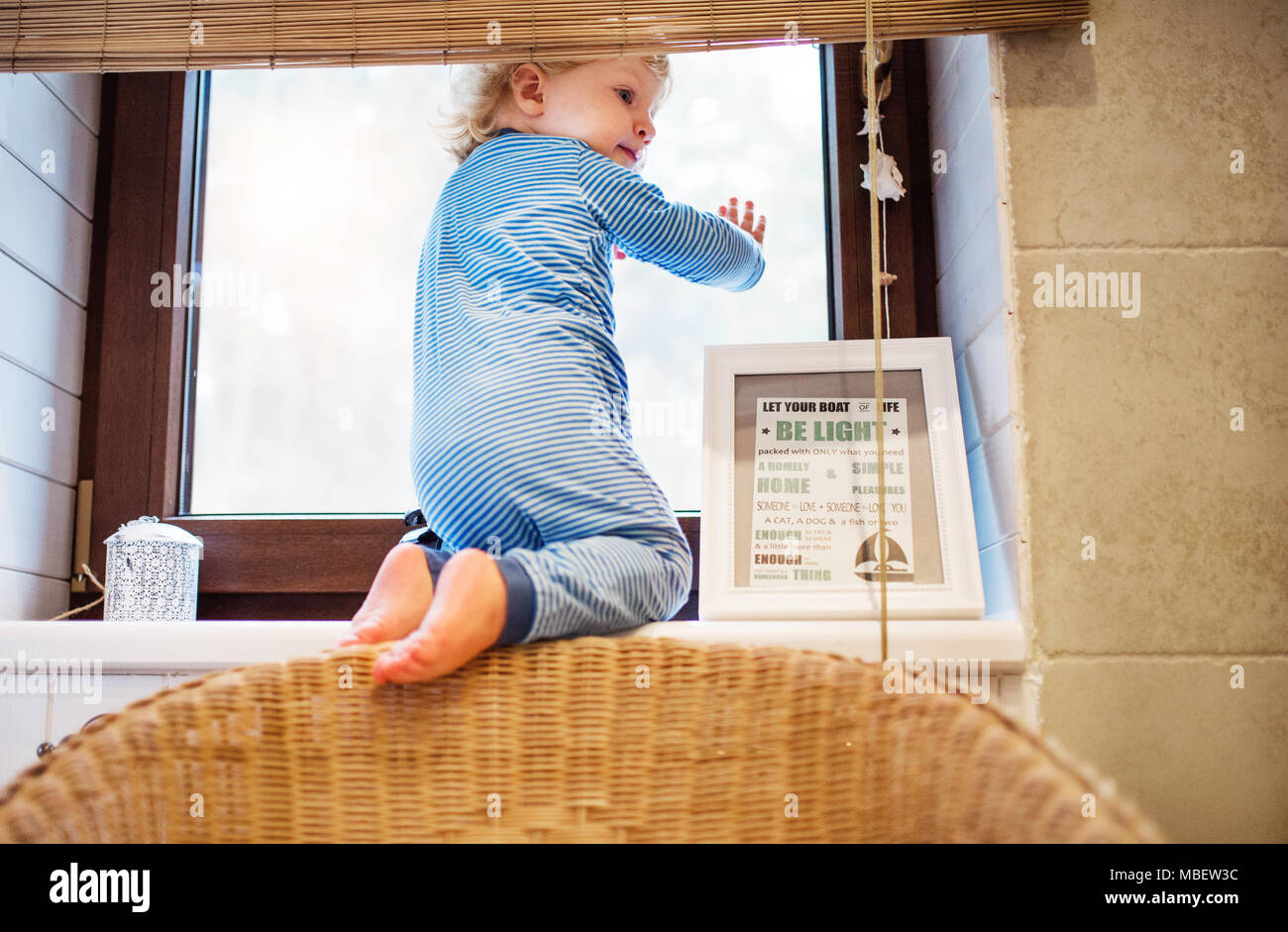 Little toddler boy opening a window. Domestic accident. Dangerous ...