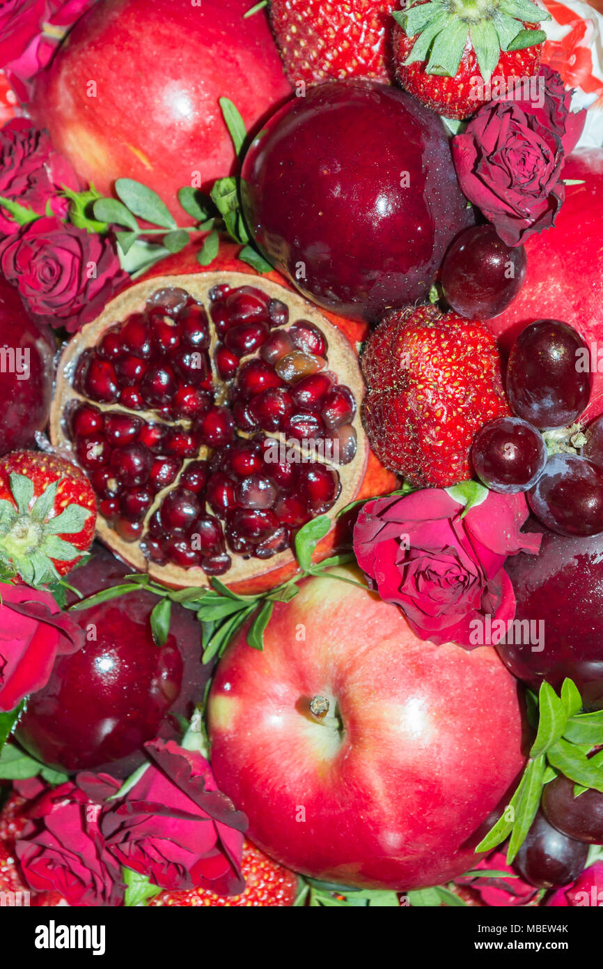 Bright red beautiful bouquet of fruits and flowers Stock Photo - Alamy