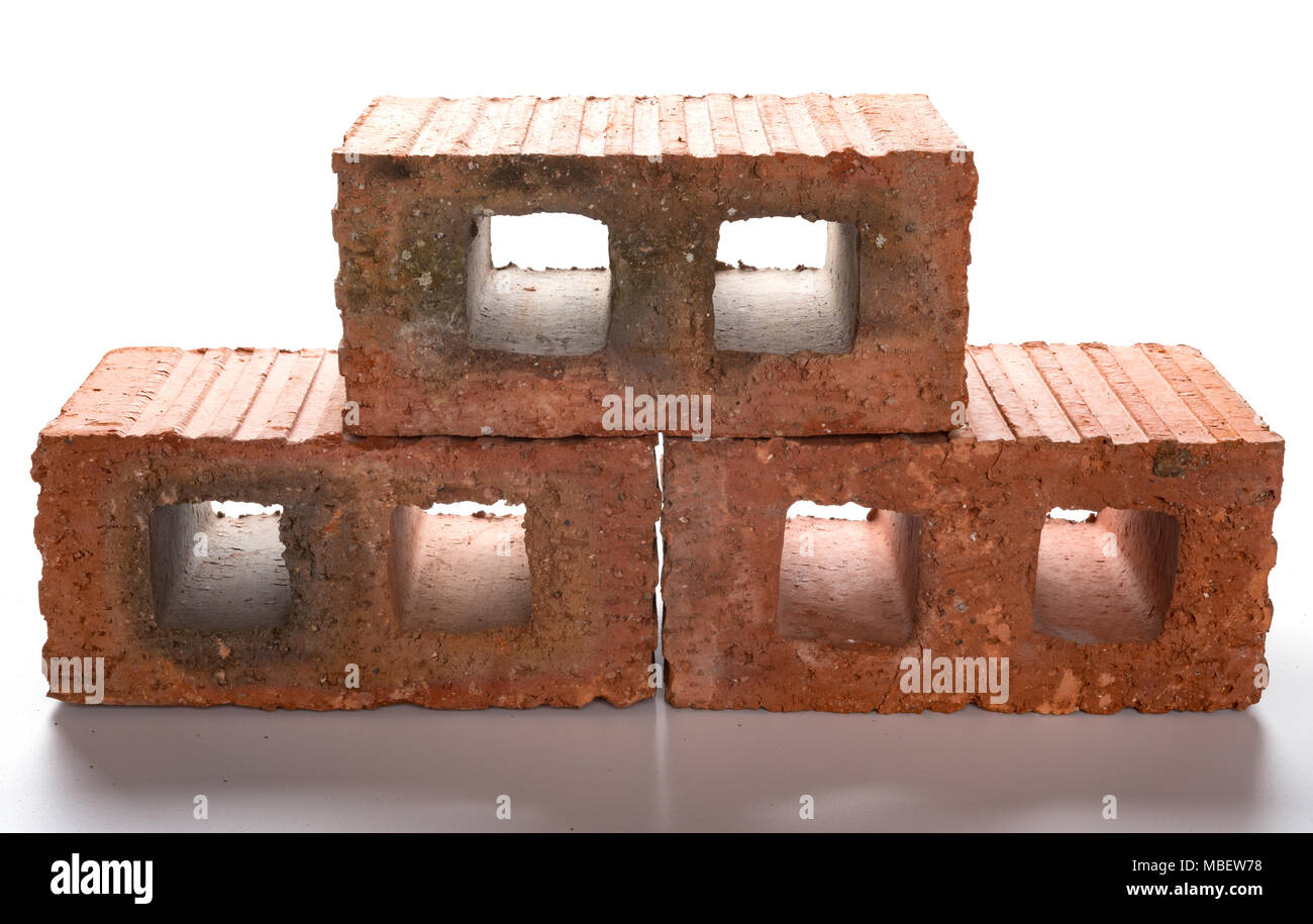 three bricks on a white background Stock Photo - Alamy