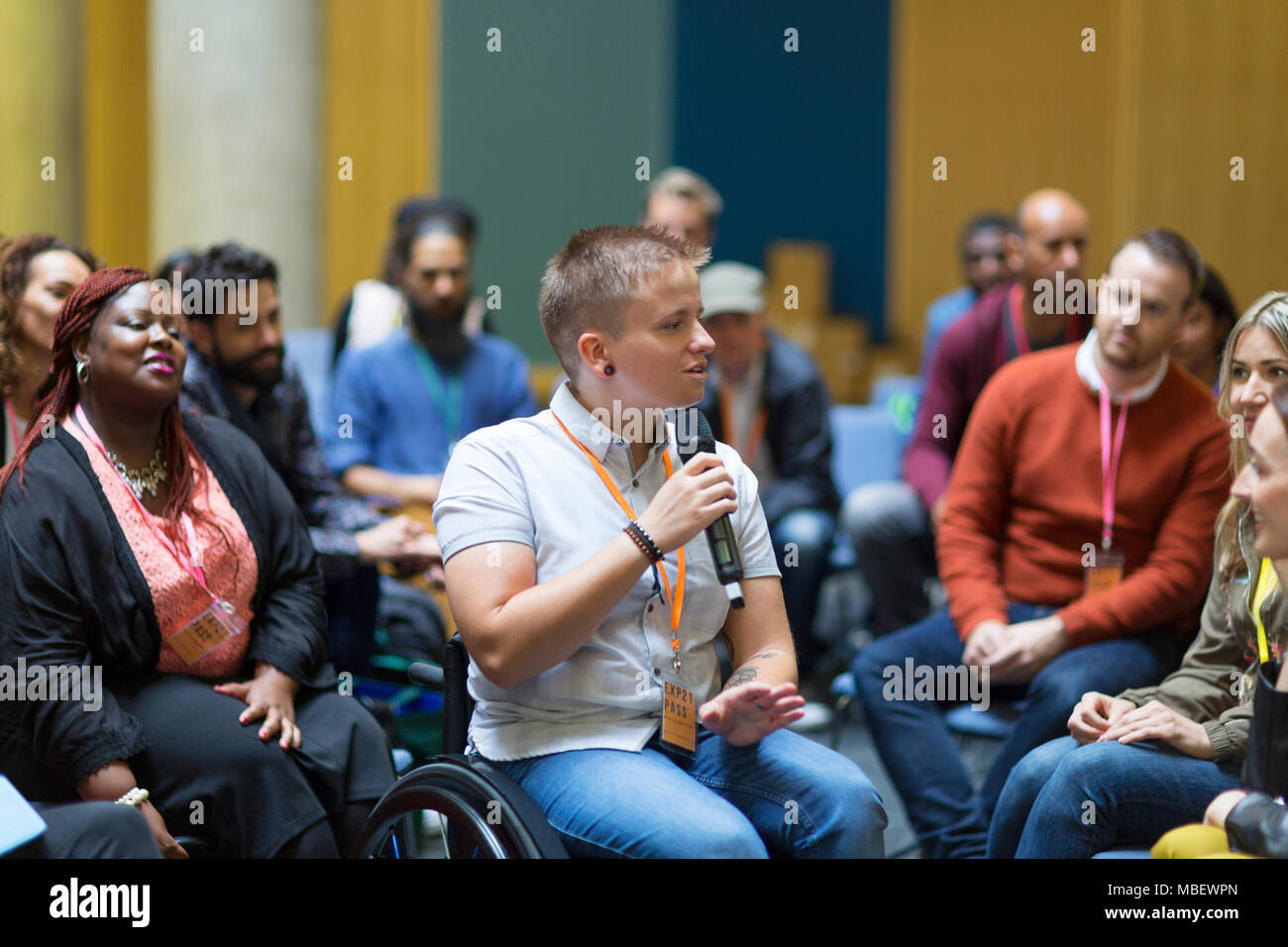 Woman talking into microphone hi-res stock photography and images - Alamy