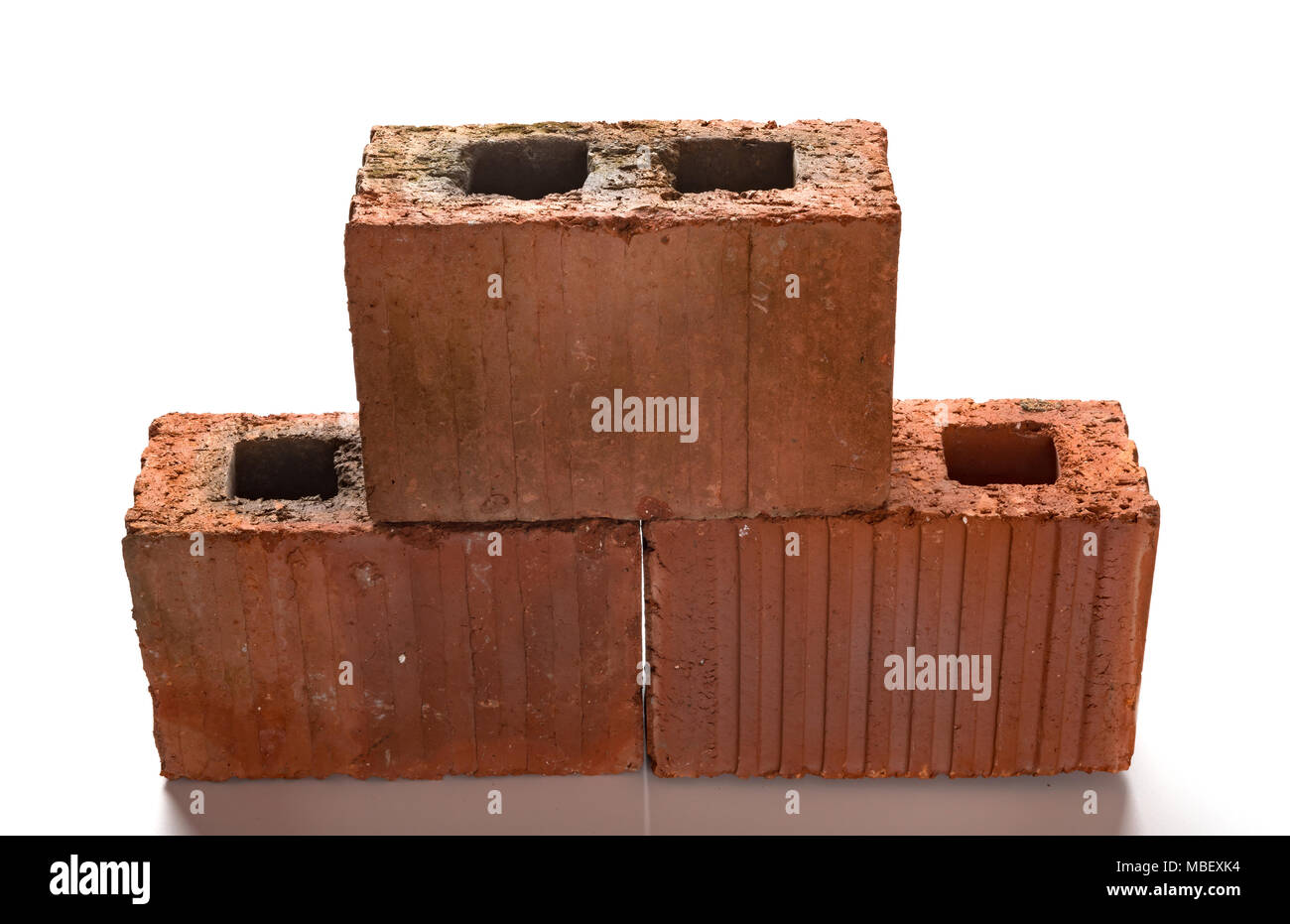 three bricks on a white background Stock Photo - Alamy