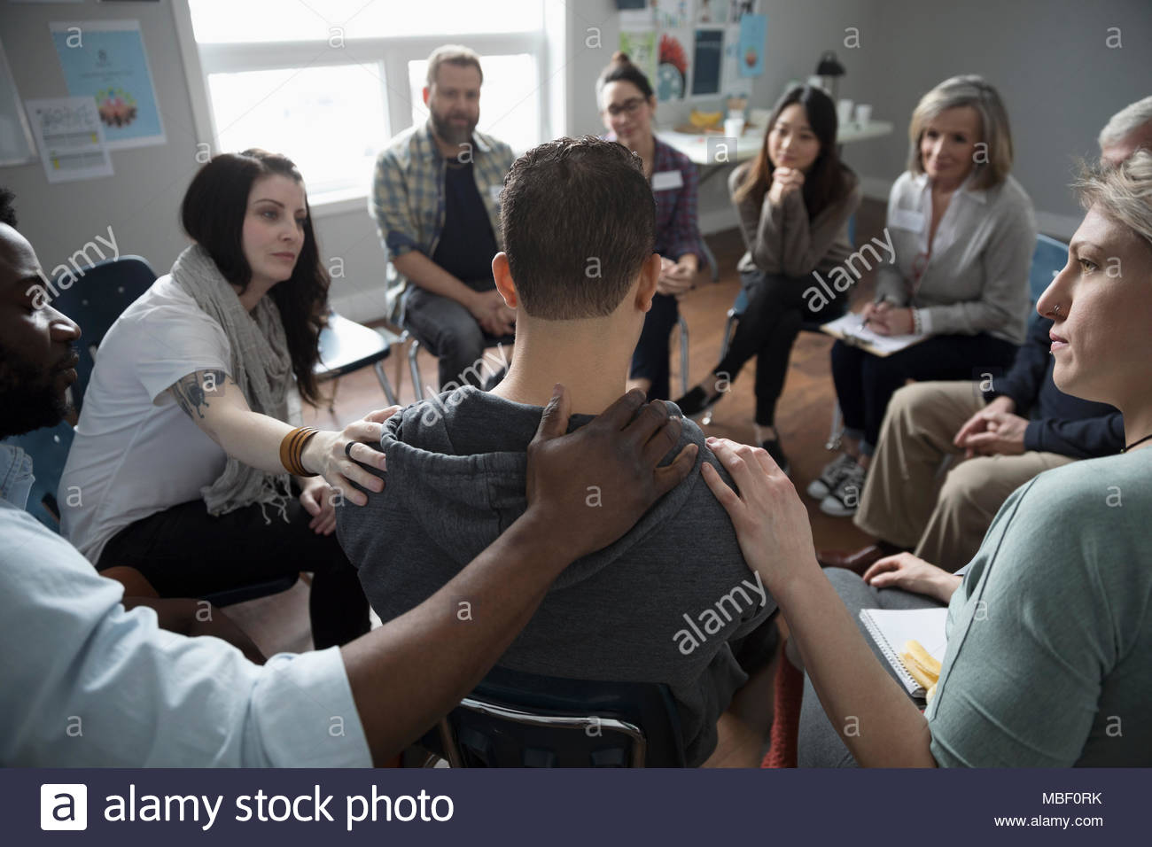 Community helping comforting hi-res stock photography and images - Alamy