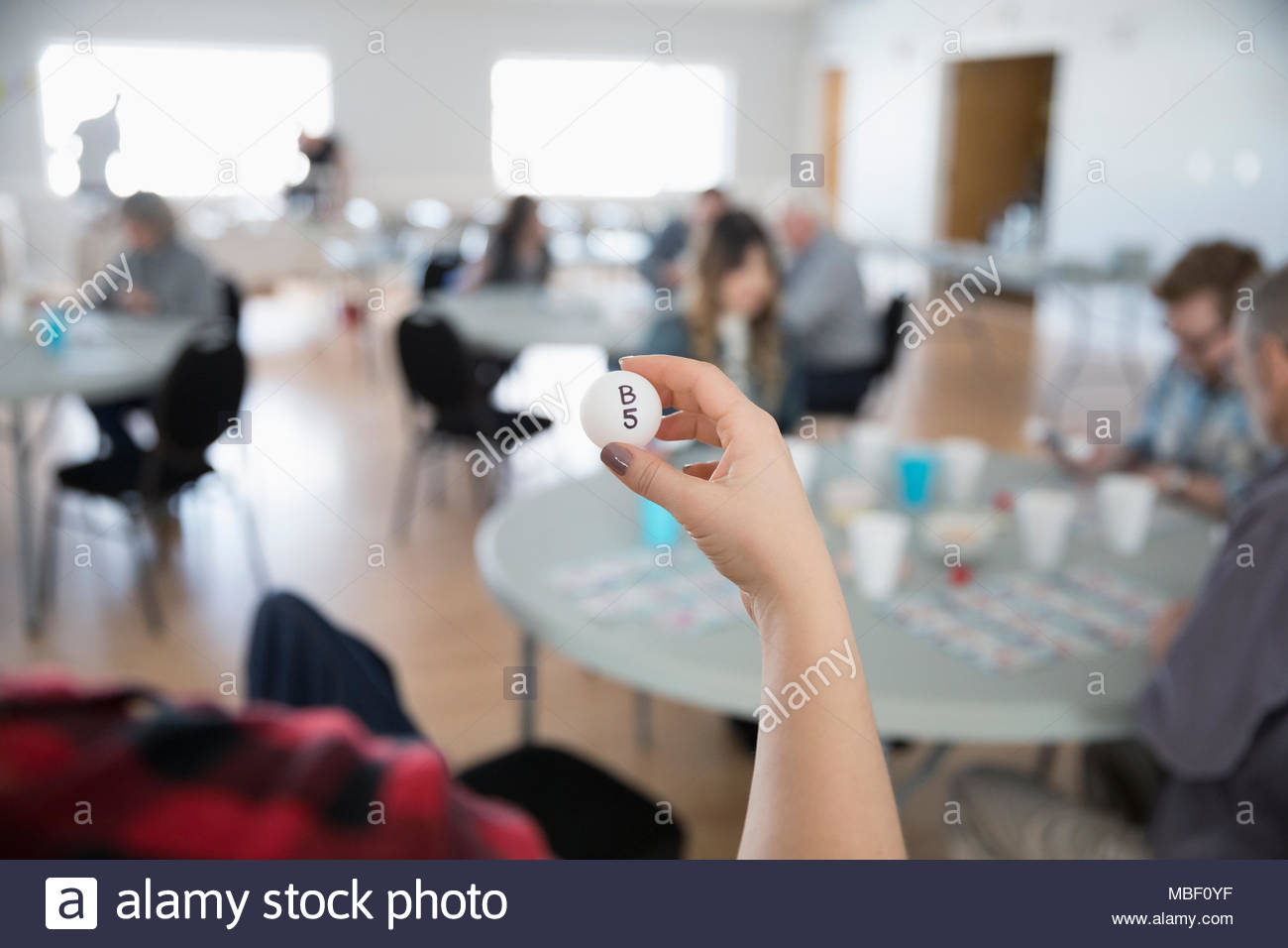 Bingo ball in hand hi-res stock photography and images - Alamy