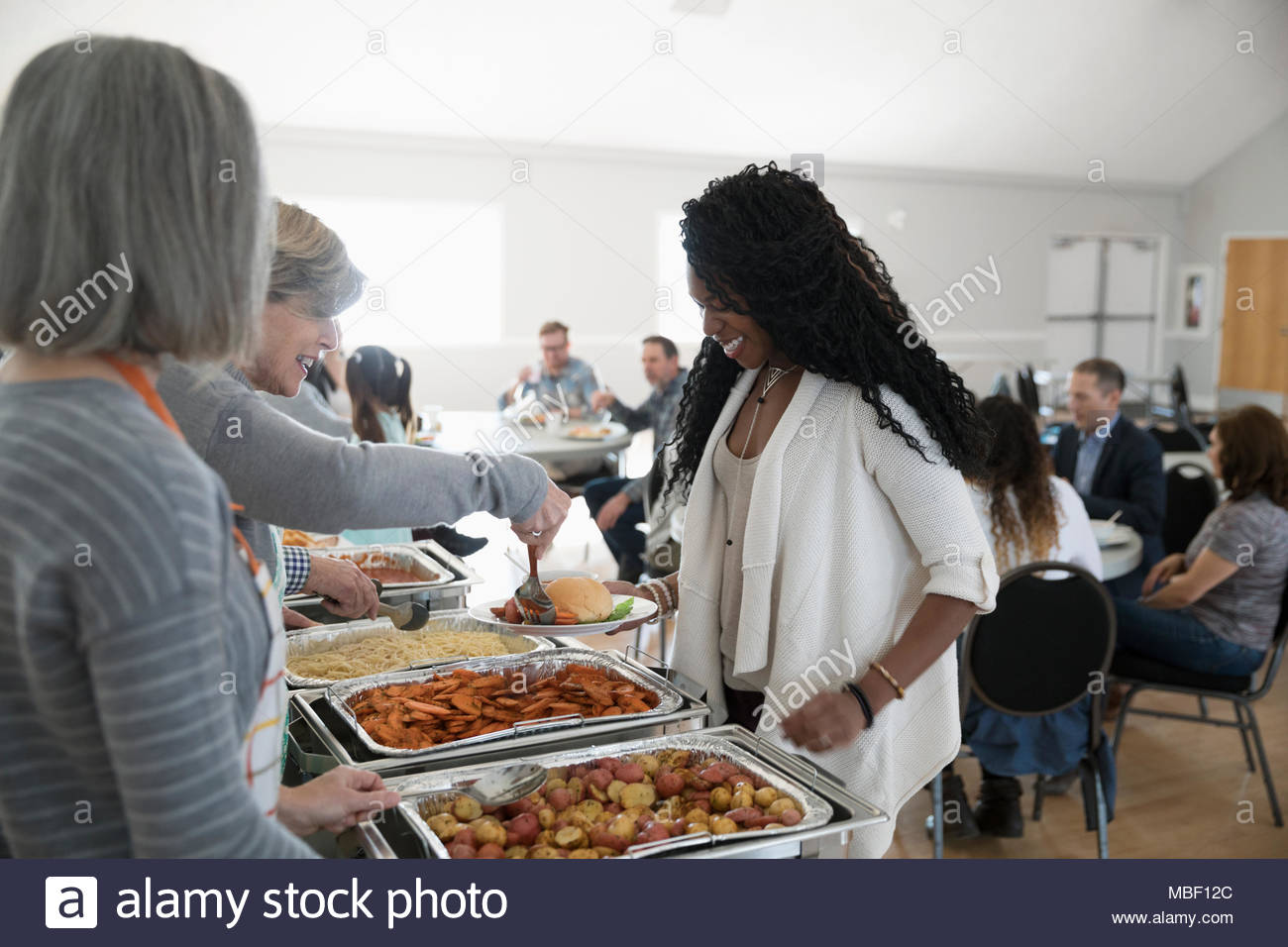 Woman hand serving food hi-res stock photography and images - Alamy