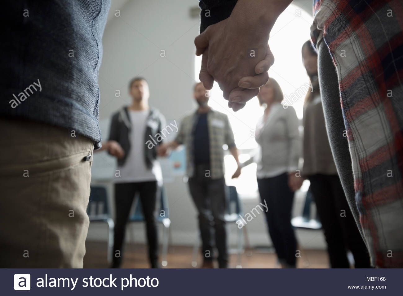 Group holding hands in a circle hi-res stock photography and images - Alamy