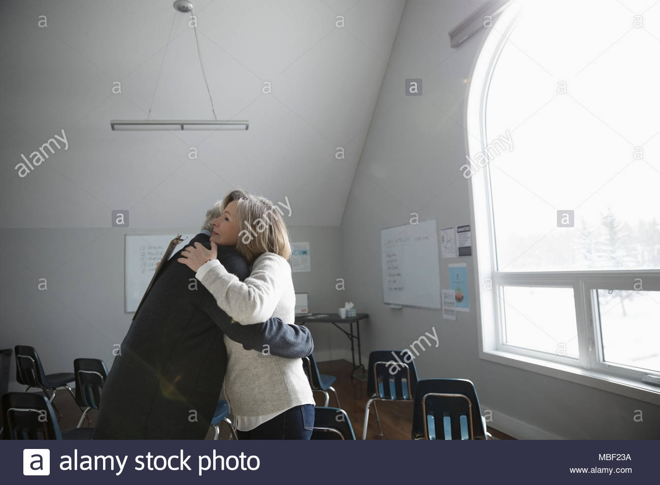 Two men hugging friends hi-res stock photography and images - Alamy