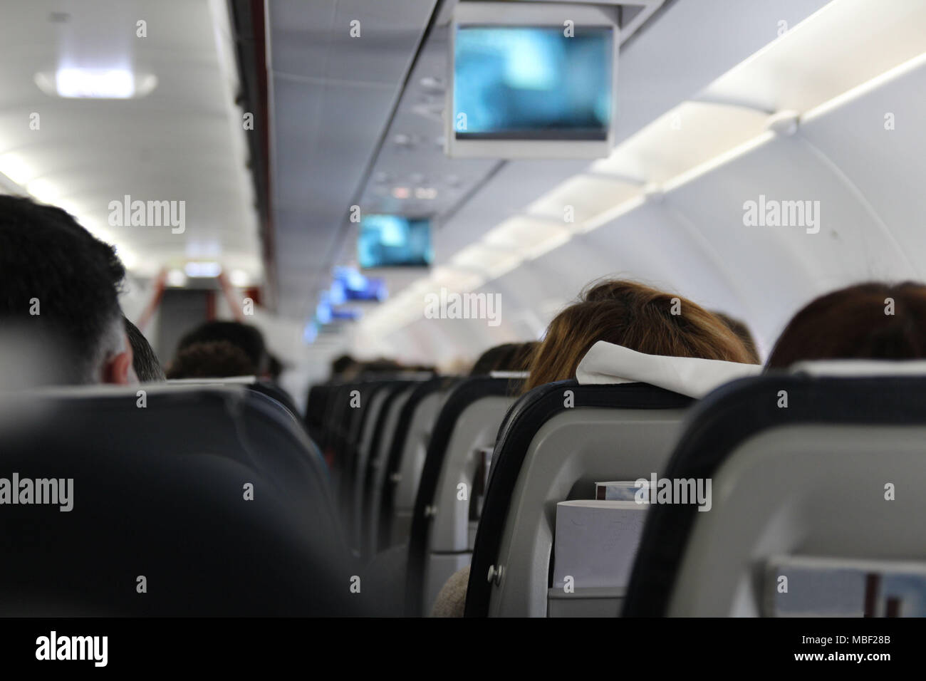 people are sitting on the plane Stock Photo - Alamy