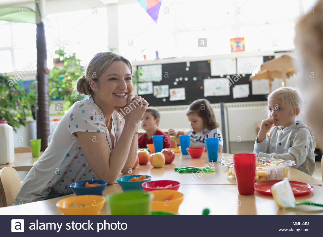 Woman snacking at her desk hi-res stock photography and images - Alamy