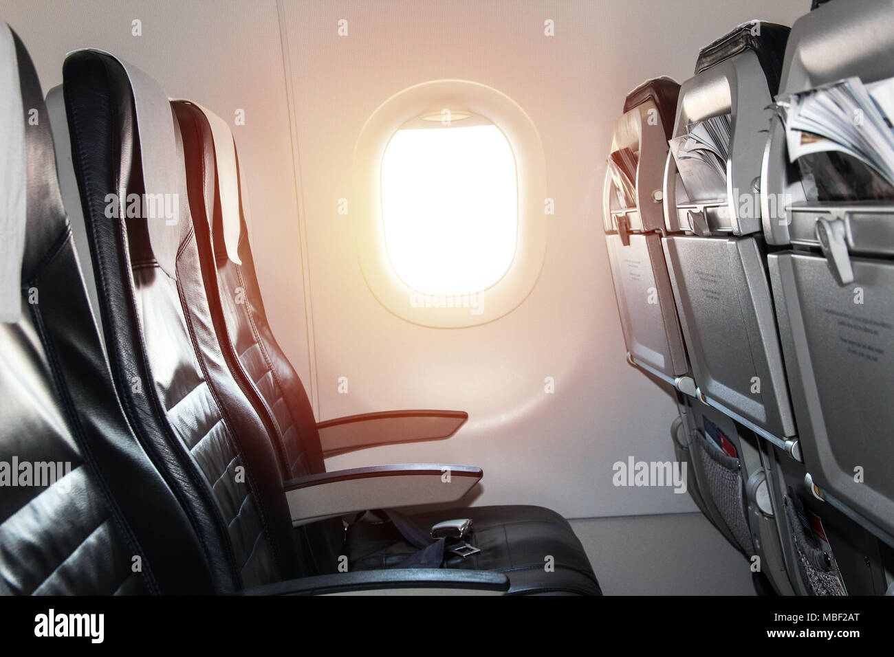 Seats of an airplane, with a window Stock Photo - Alamy