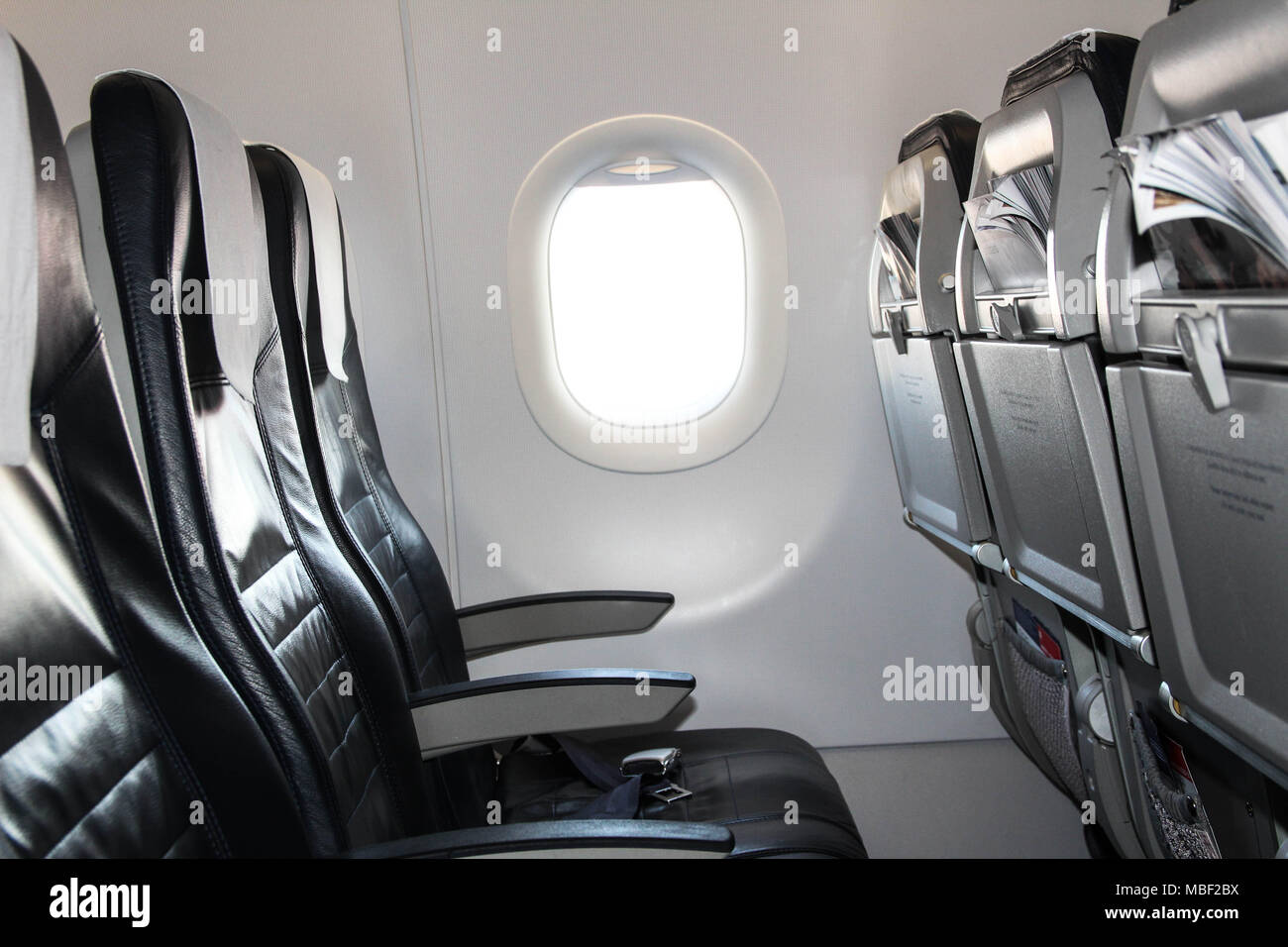 Seats of an airplane, with a window Stock Photo - Alamy