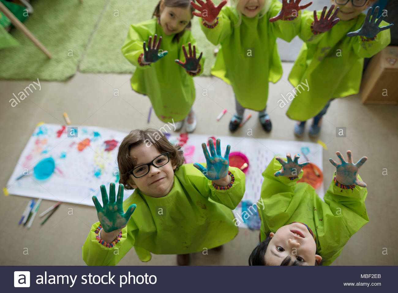 Student raised hands in classroom hi-res stock photography and images ...