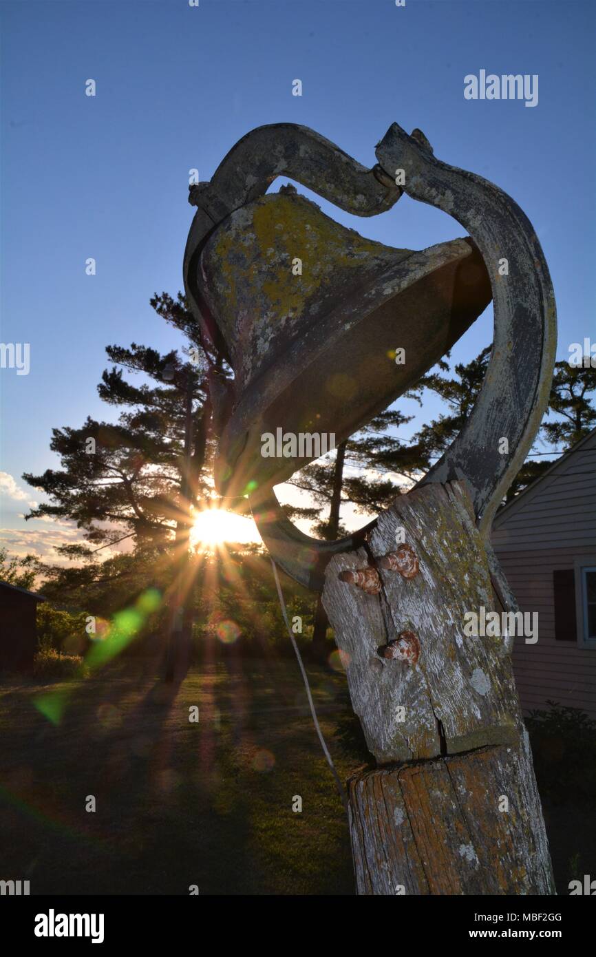 Artistic sunset with vintage dinner bell ringing southeast Iowa USA ...