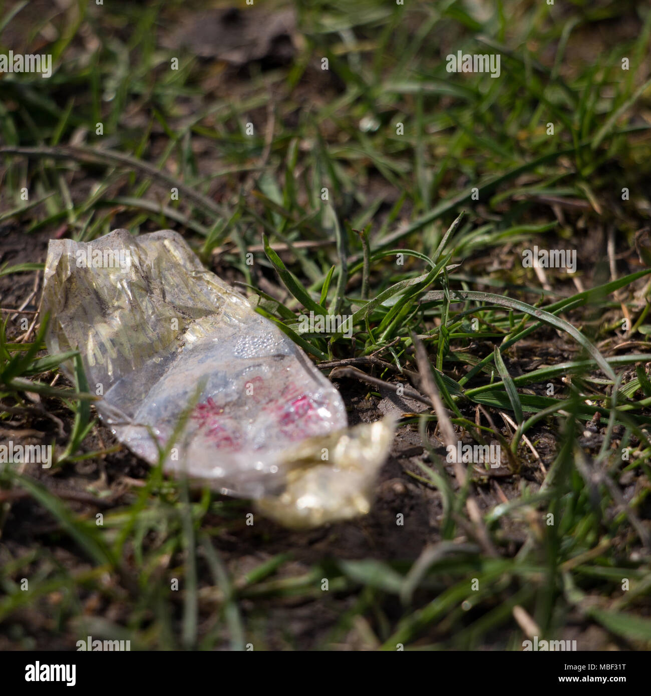 Candy wrapping on the ground Stock Photo - Alamy