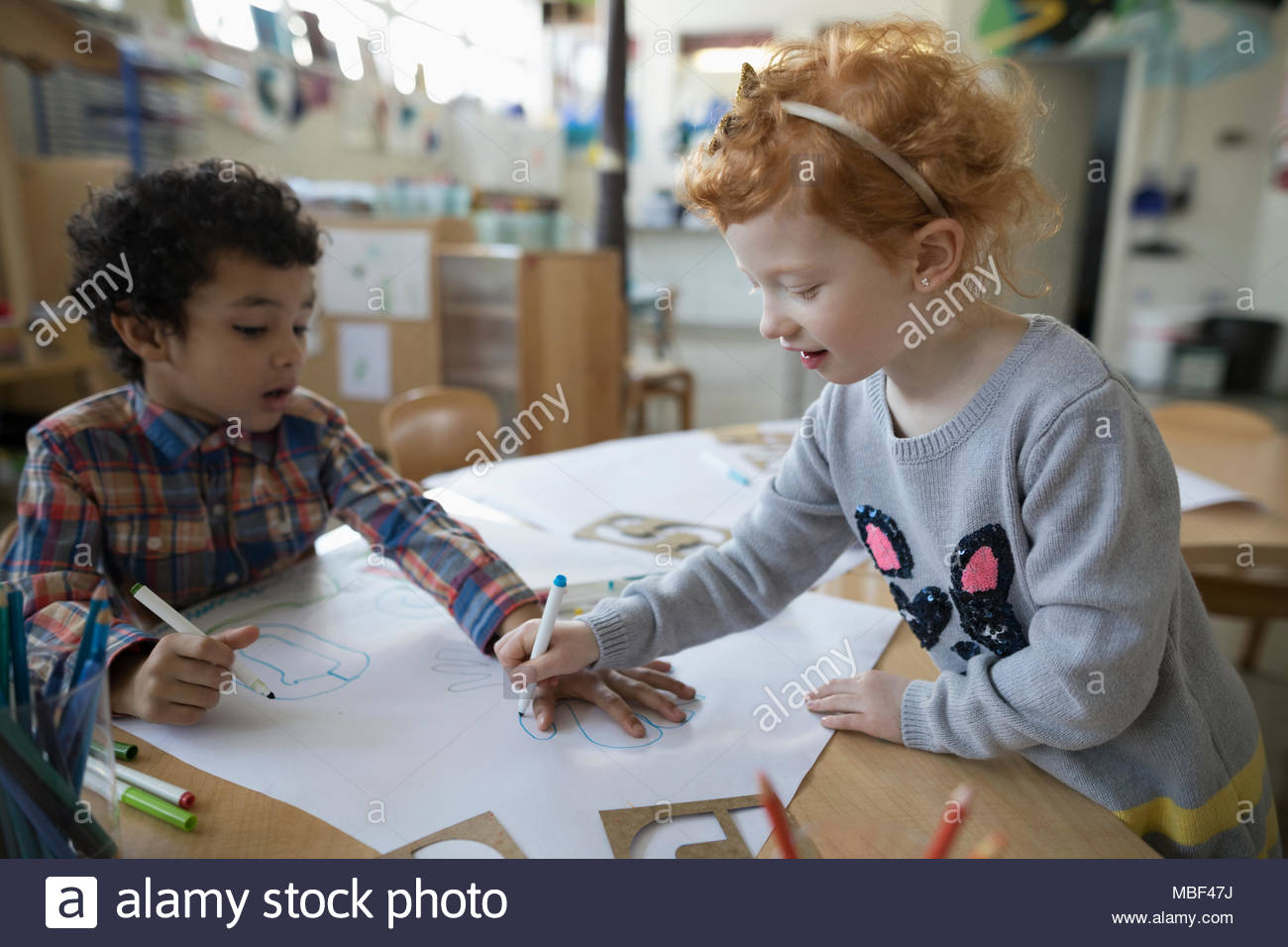 Boy and girl sharing hi-res stock photography and images - Alamy