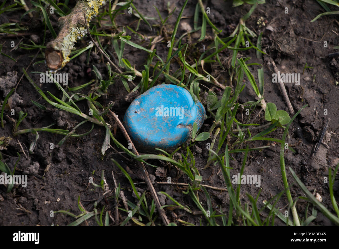 Plastic cap on the ground Stock Photo - Alamy