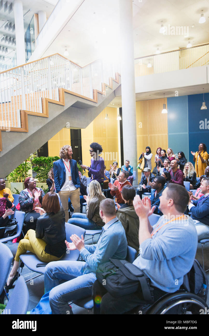 Conference audience clapping for speakers Stock Photo - Alamy