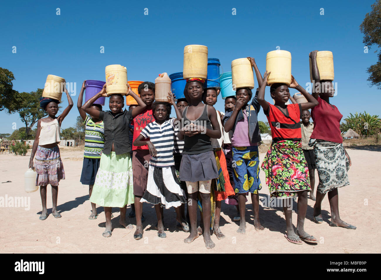 girls in Africa fetching water Stock Photo - Alamy