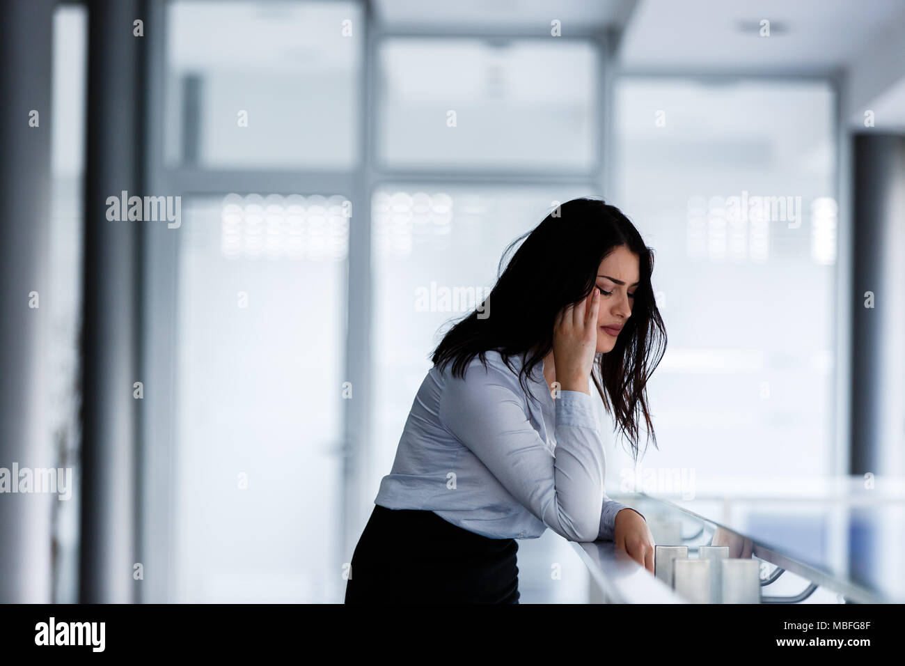 Depressed and sad girl having problems on her job Stock Photo - Alamy