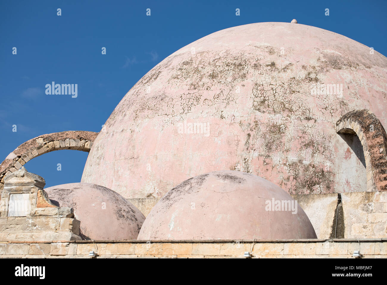 The dome, cupola of an old mosque in Chania, Crete, Greece. Blue sky in ...