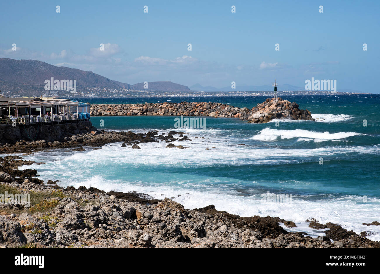 Sisi, Crete, Greece. 2017. Seafront resaurant on the harbour entrance ...