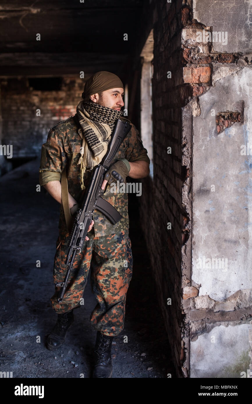 The Arab soldier with the AK-47 Kalashnikov assault rifle Stock Photo ...