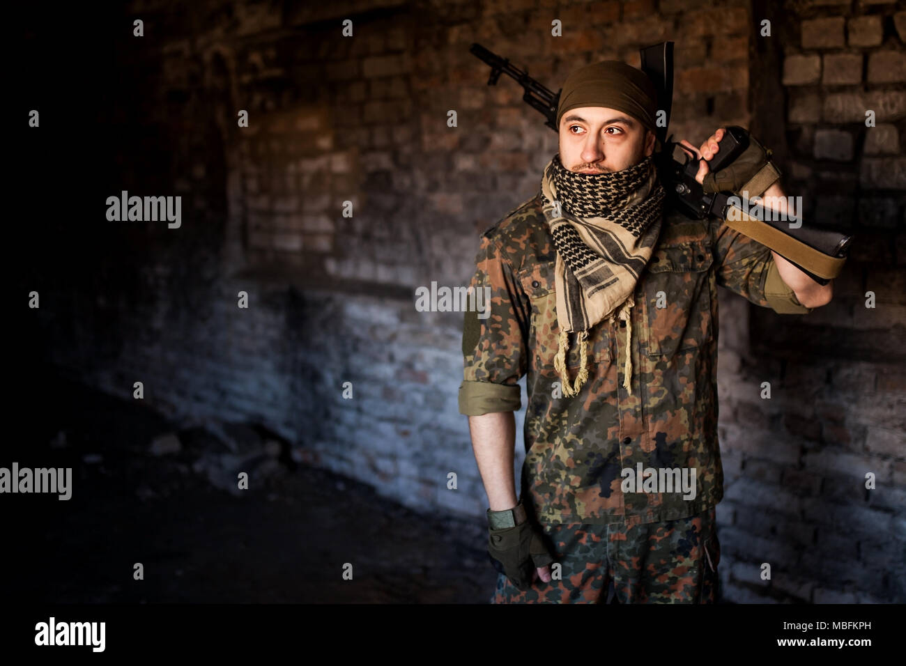 The Arab soldier with the AK-47 Kalashnikov assault rifle Stock Photo ...