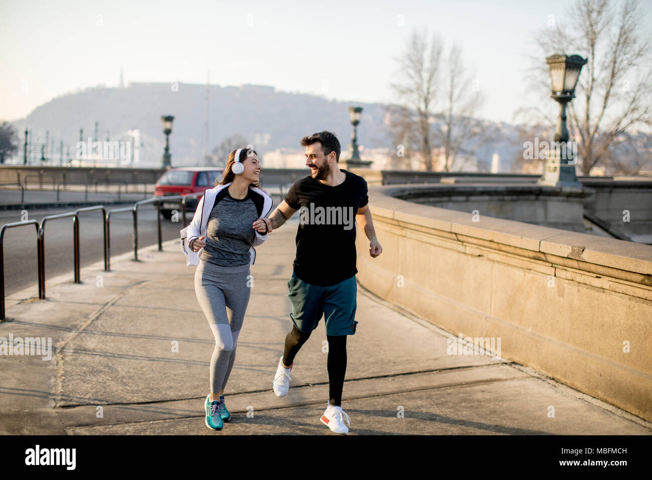 Young couple running in the morning as a good habit Stock Photo - Alamy