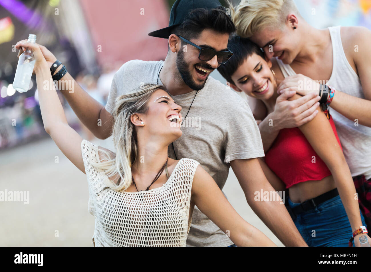 Happy friends having fun at music festival Stock Photo - Alamy