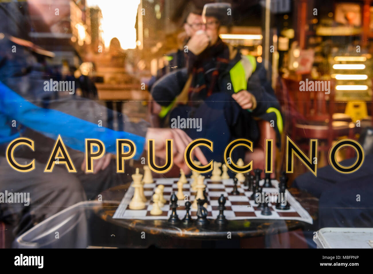Men play chess in a coffee shop during the Belfast Culture Night Stock ...