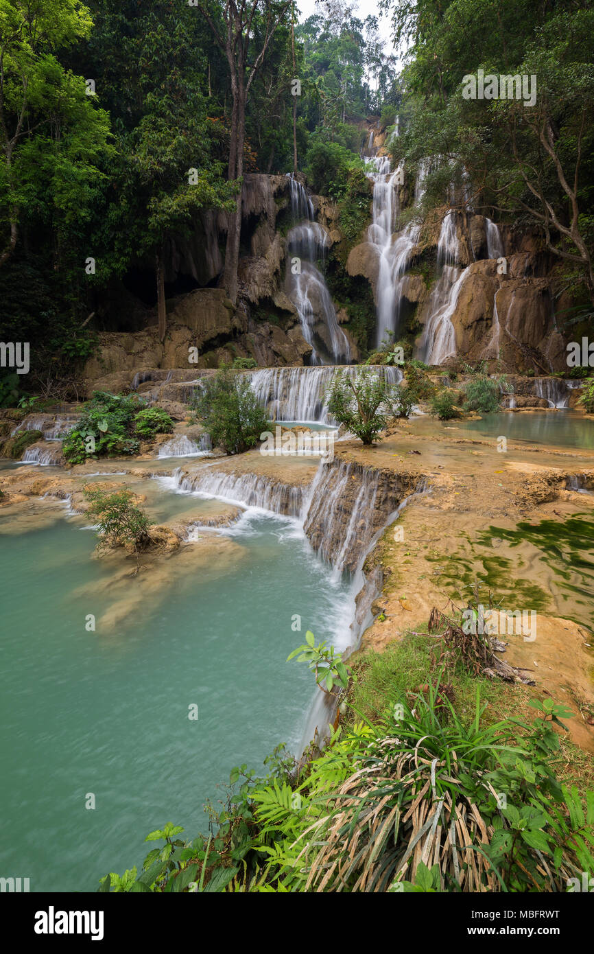 Side view of the beautiful main fall at the Tat Kuang Si Waterfalls ...