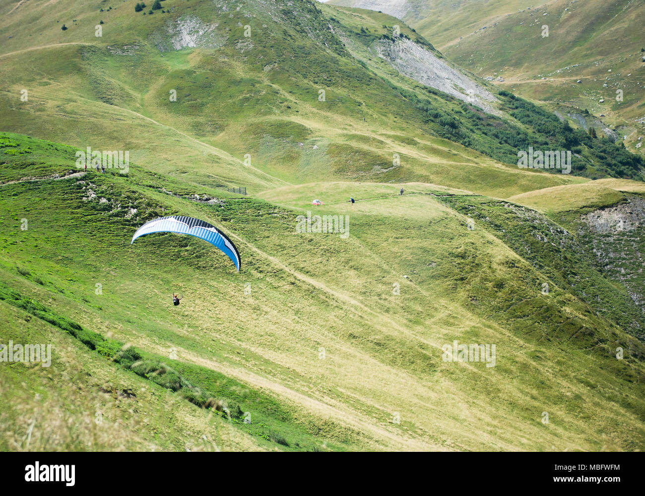 Man flying green paraglide hi-res stock photography and images - Alamy