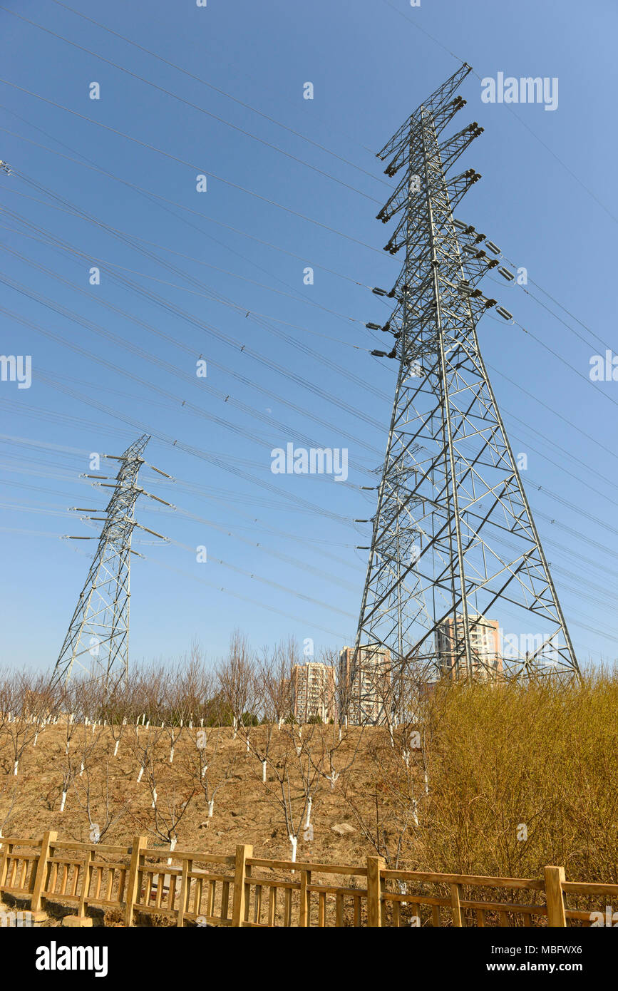 Electricity pylons or transmission towers stand in the outer western ...