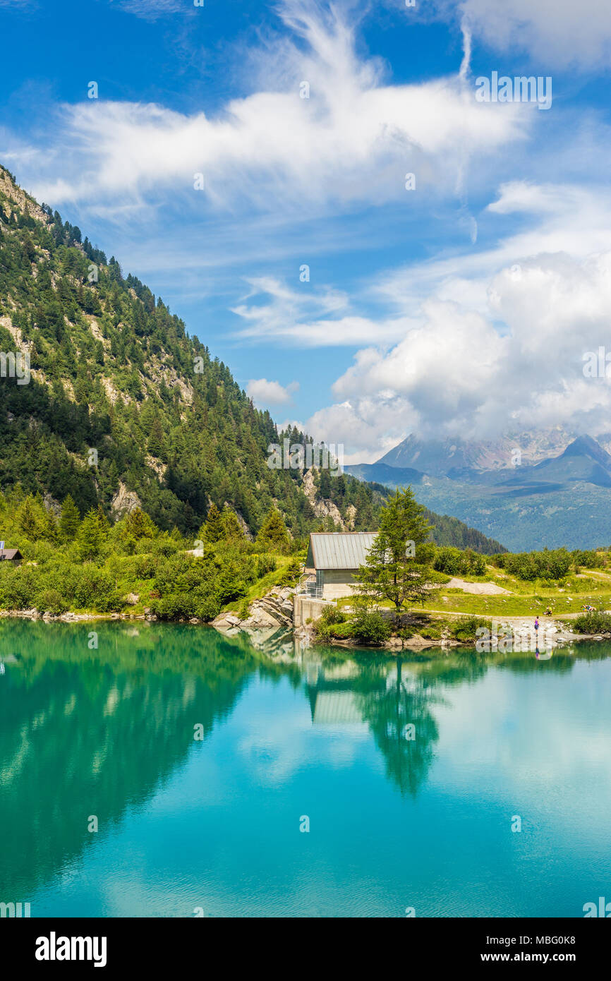 Amazing view on Aviolo Lake with forest and sky reflected on the water ...