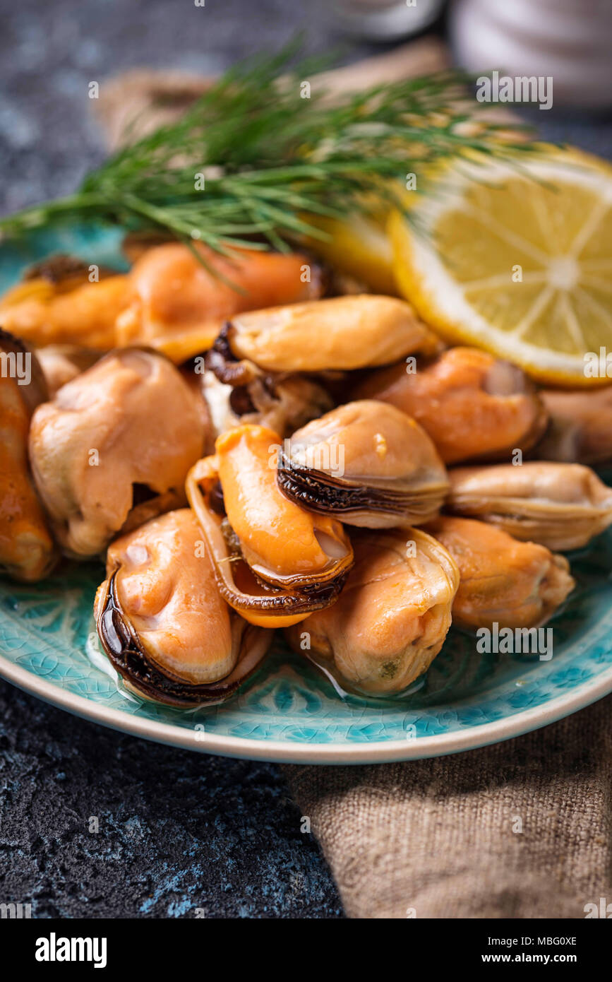 Marinated mussels with lemon and spices Stock Photo - Alamy