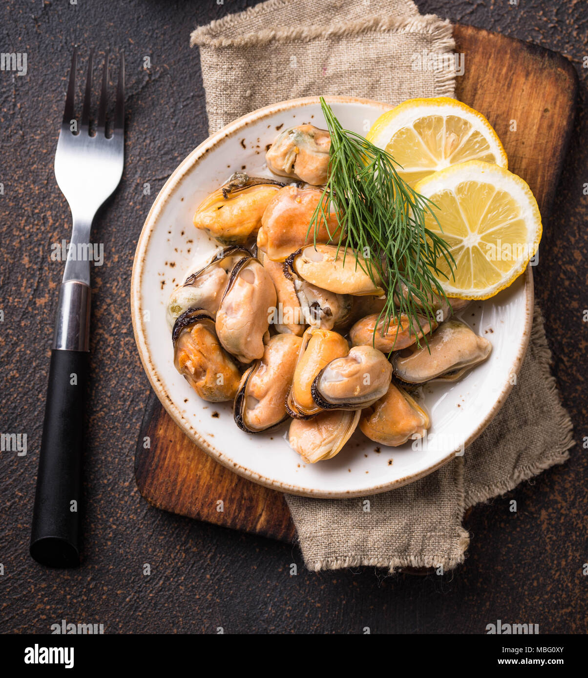 Marinated mussels with lemon and spices Stock Photo - Alamy