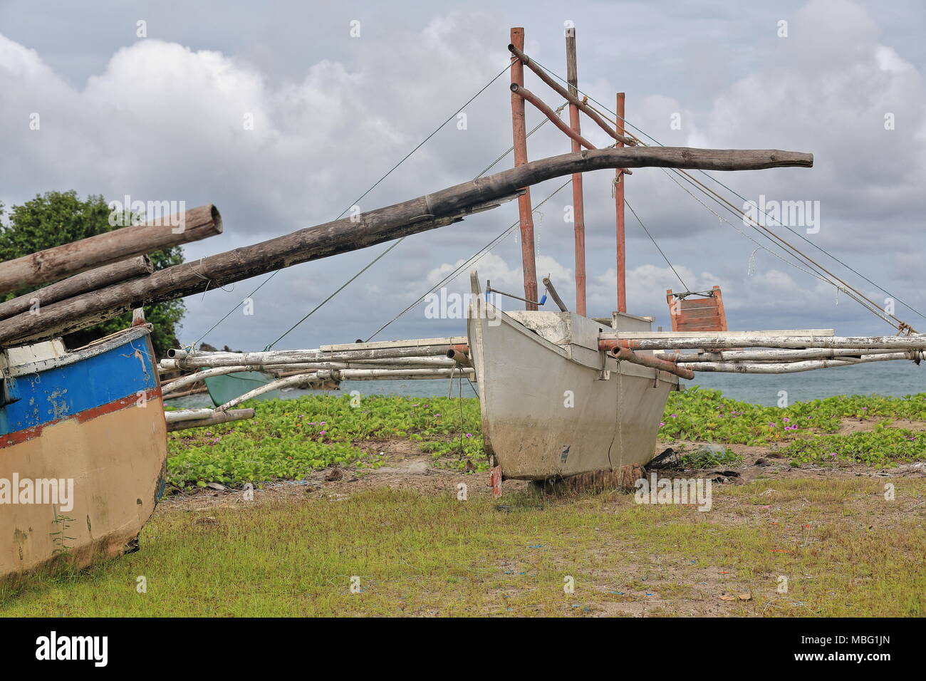 Deserted balangay or bangka boats for fishing and tourist service-out ...