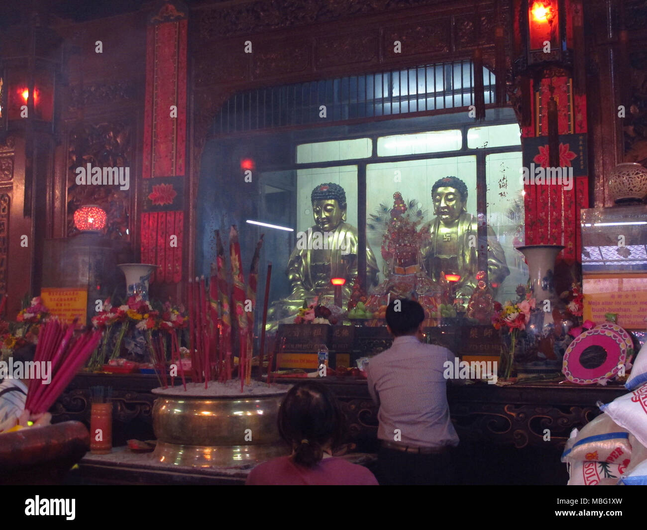 buddhist people practising religion in a temple Stock Photo - Alamy