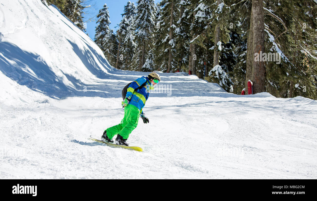 Image of man riding snowboard from snowy hill Stock Photo - Alamy