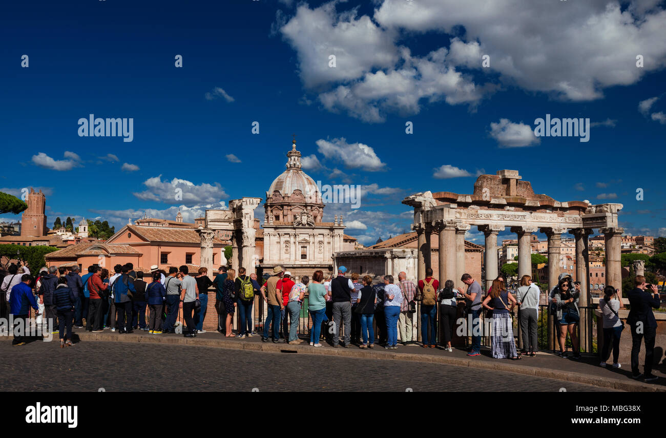 Tourists admire the beautiful view of Roman Forum and shoot selfie with ...