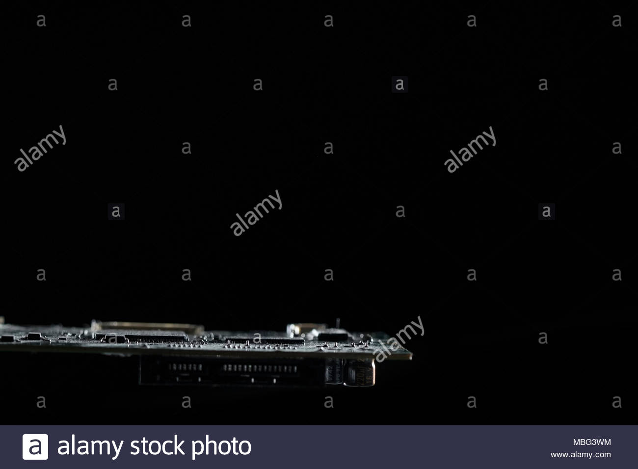 Dark circuit board on black background Stock Photo - Alamy