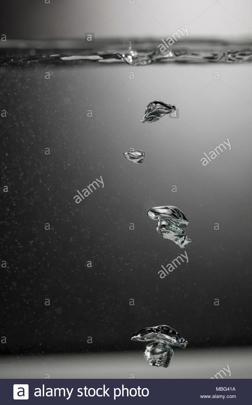 Water bubbles rising to the surface Stock Photo - Alamy