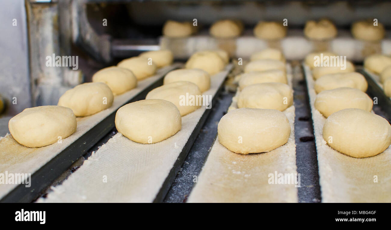 Preparing and weighing dough in a large bakery Stock Photo - Alamy