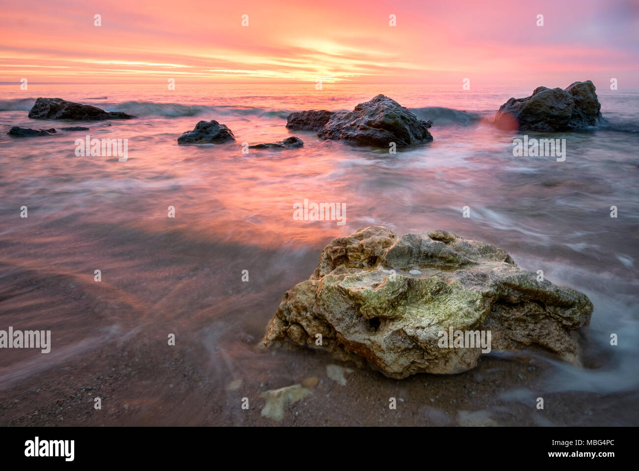 Rocks, foreground on beach sunset hi-res stock photography and images ...