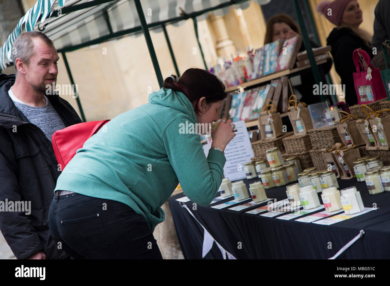shopper sampling goods at local town market Stock Photo - Alamy