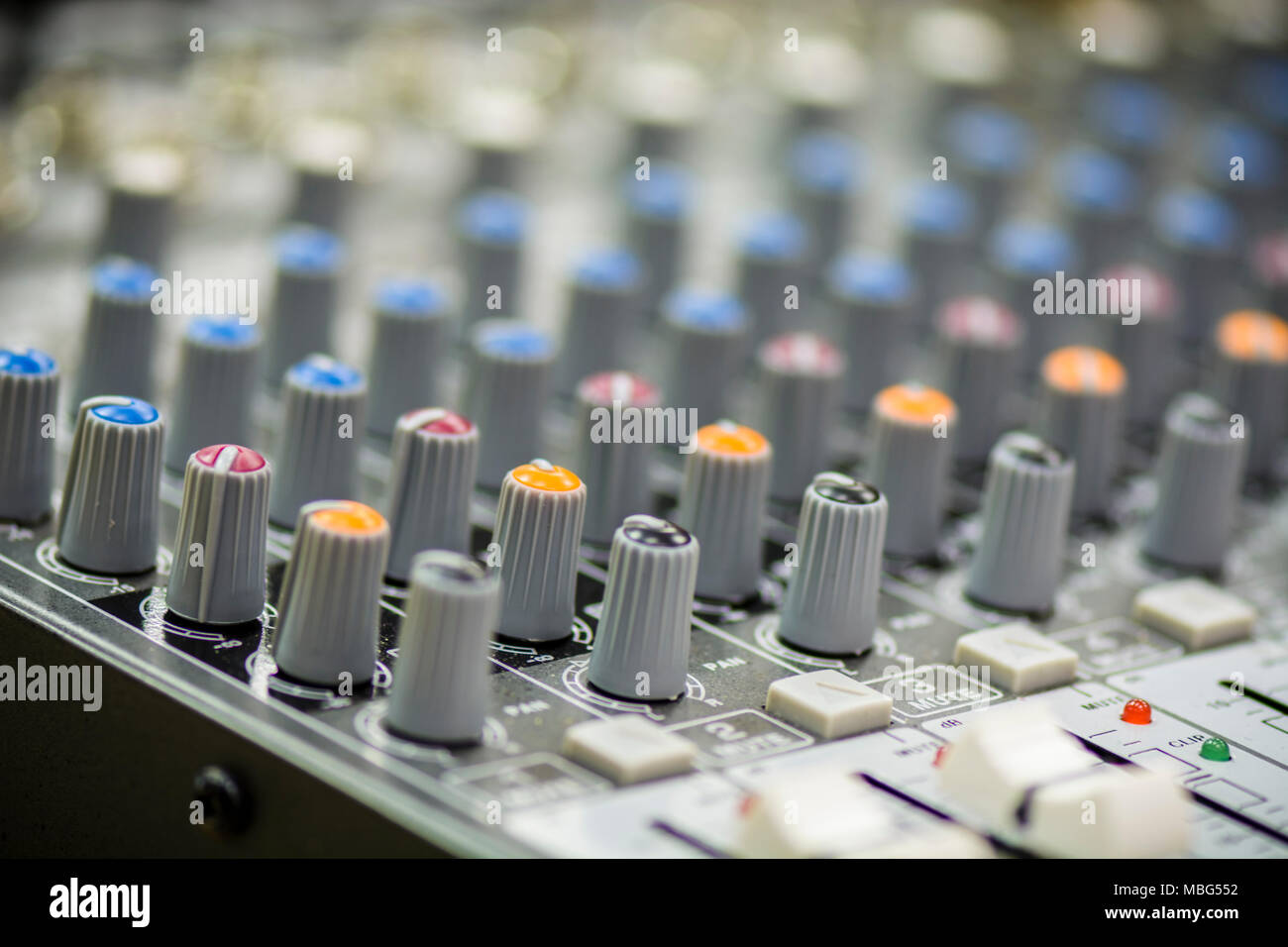 Close up of a mixing console with sliders and buttons Stock Photo - Alamy