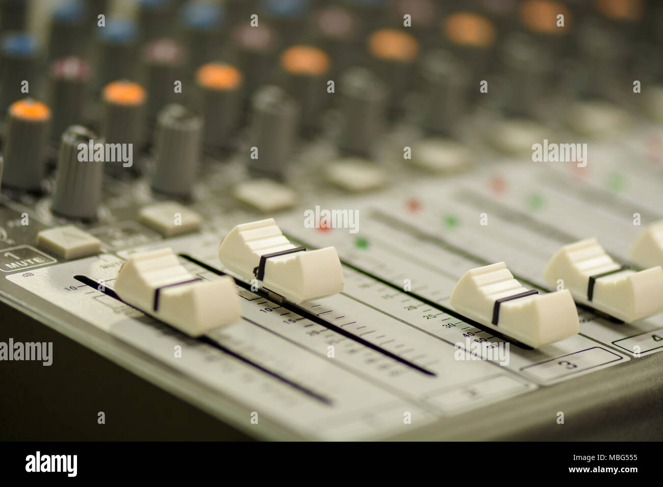 Close up of a mixing console with sliders and buttons Stock Photo - Alamy